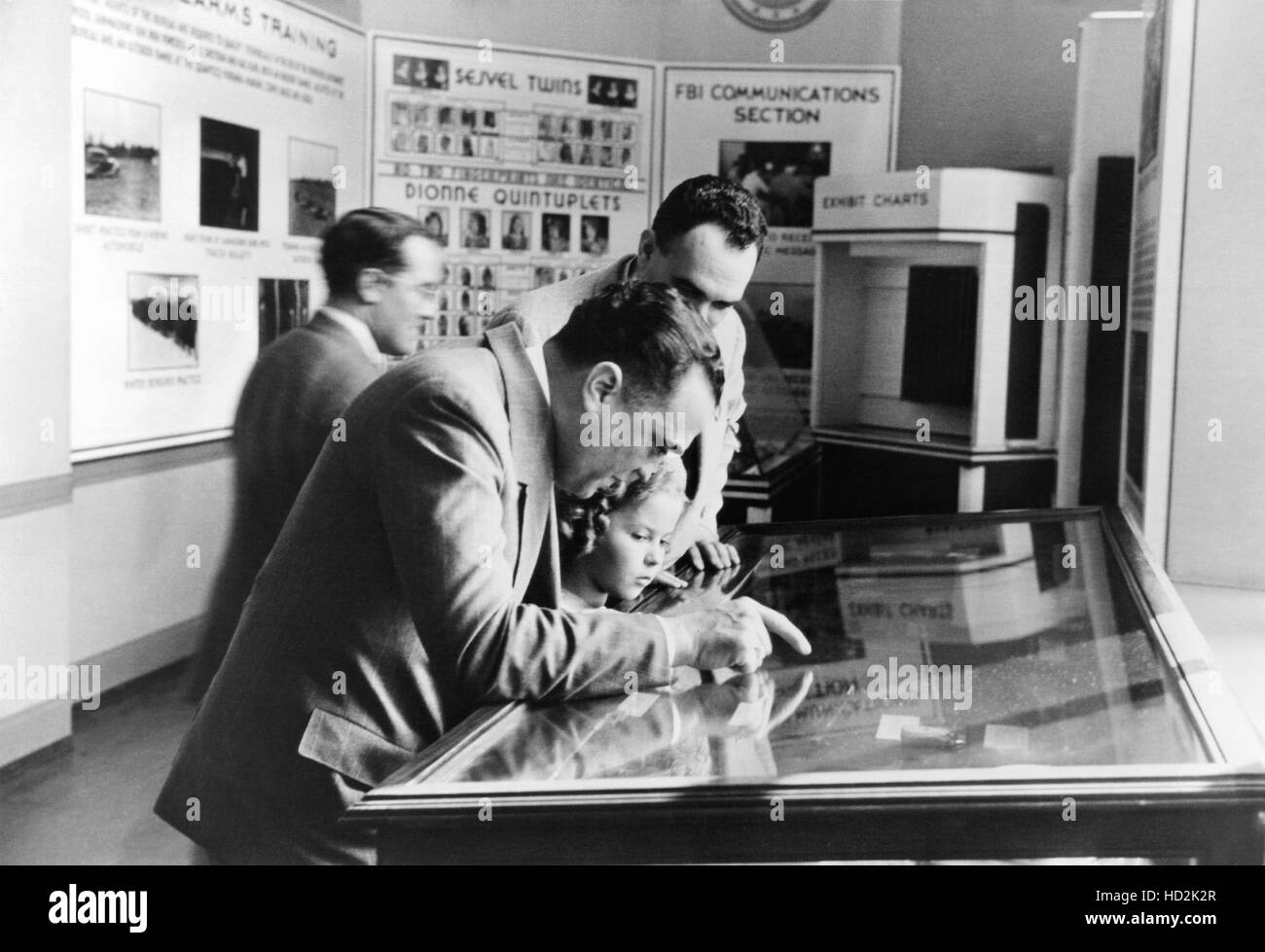 Shirley Temple touring FBI headquarters with J. Edgar Hoover (front ...