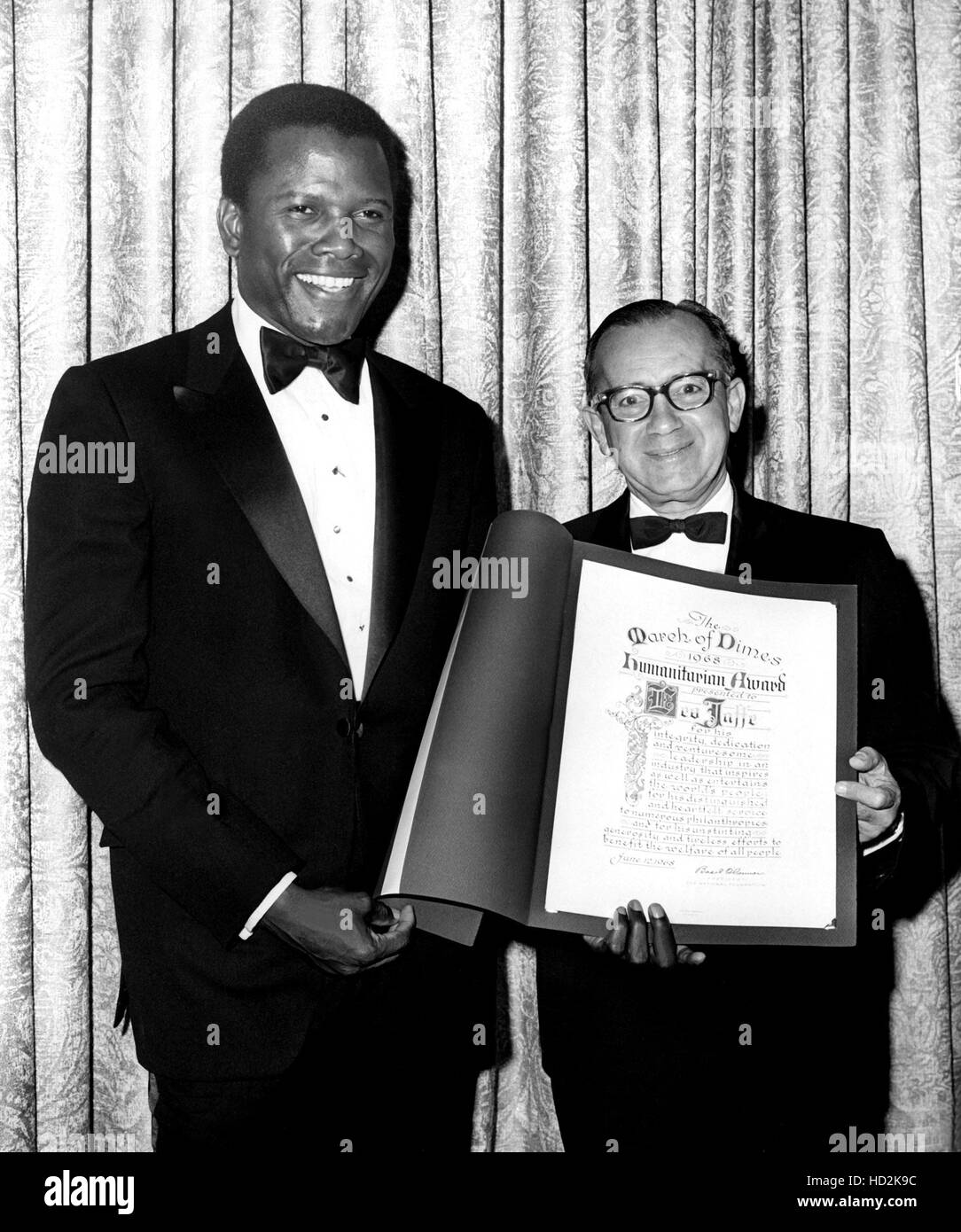 SIDNEY POITIER, with Columbia Pictures president Leo Jaffe, presenting ...