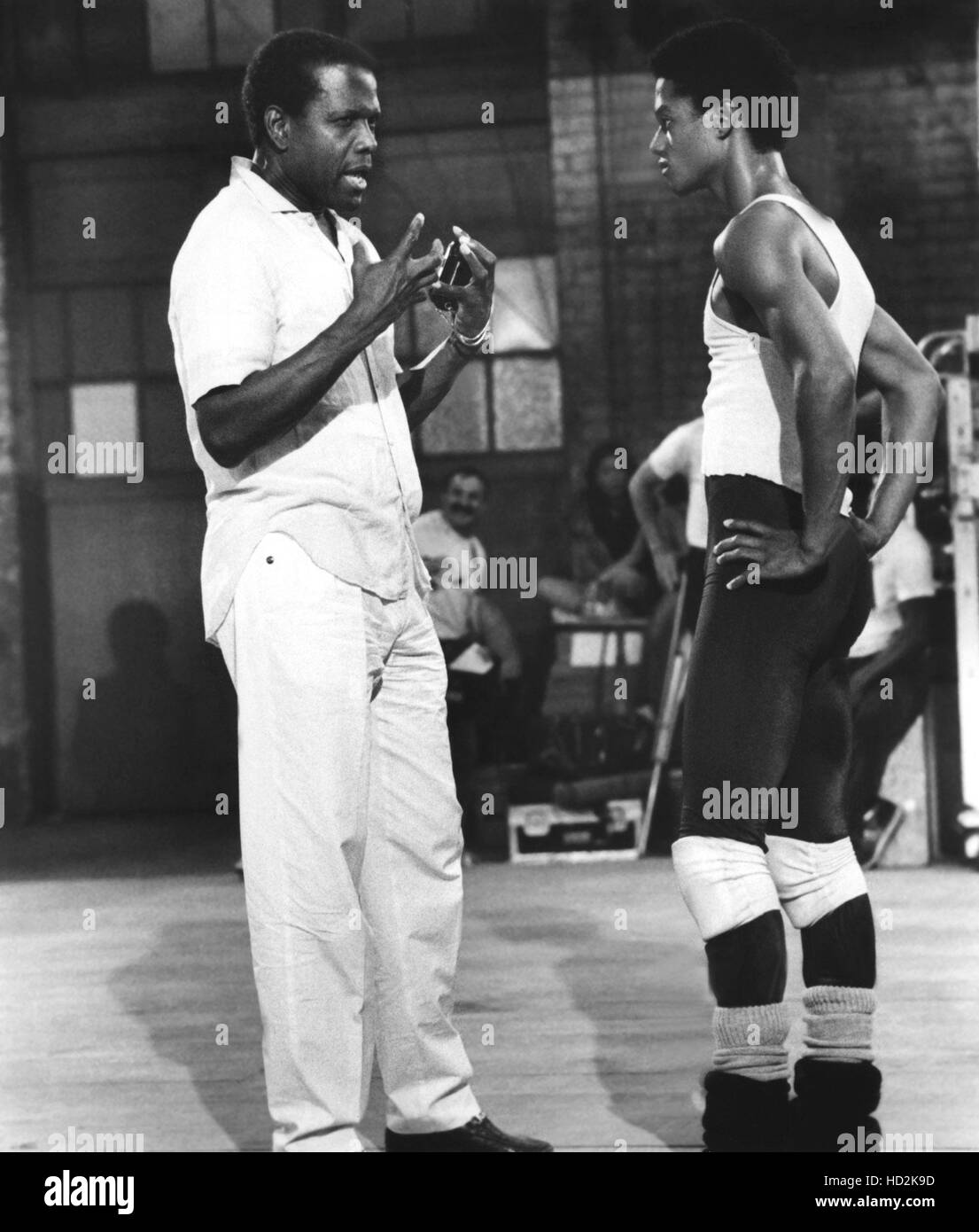 SIDNEY POITIER, directing actor Don Franklin on the set of the film ...