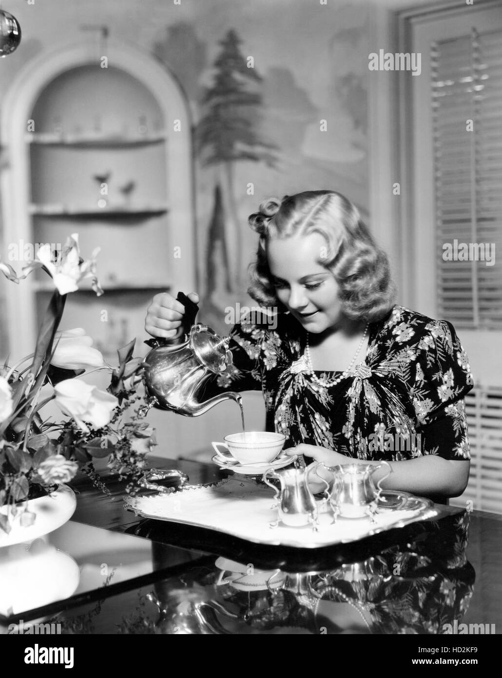 Sonia Henie pours afternoon tea at her home, ca. 1938. ©20th Century ...