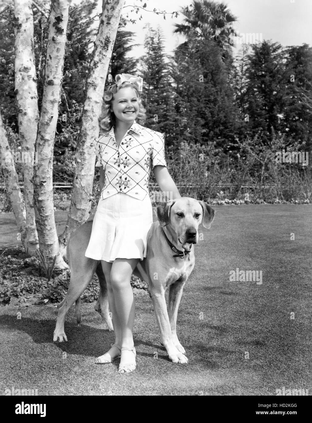 Sonja Henie poses in her backyard with her dog, Master, ca. 1938. ©20th ...