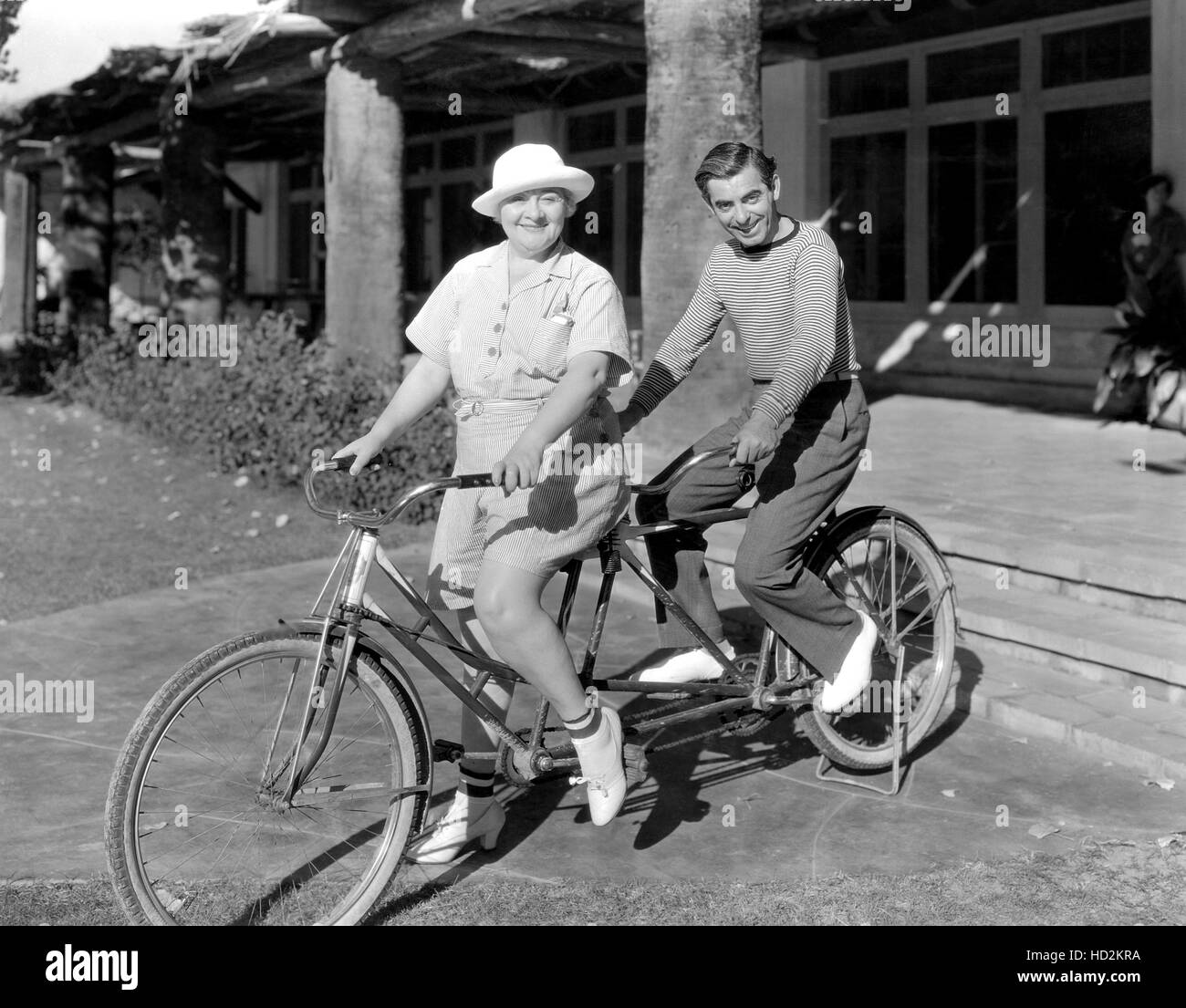 Sophie Tucker and Eddie Cantor riding bicycle built for two while ...