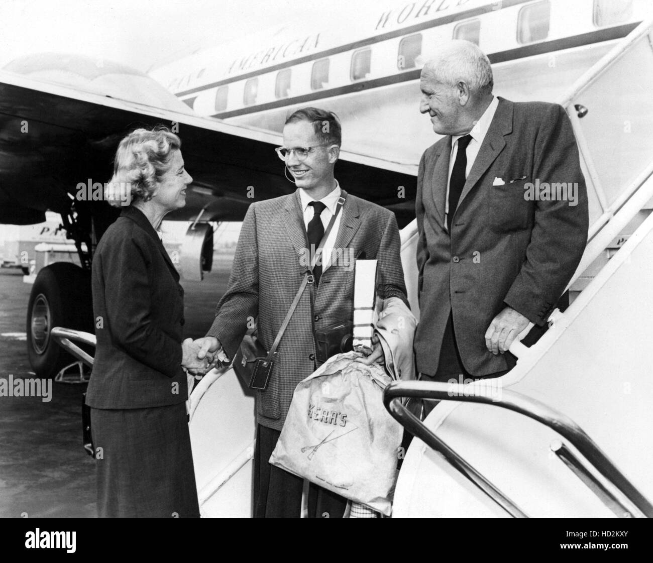LOUISE TRACY greets son JOHN TRACY and husband SPENCER TRACY at airport ...
