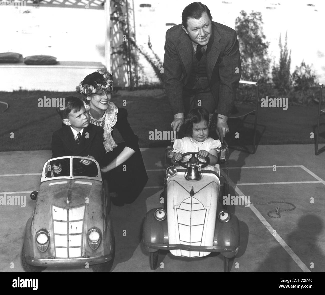 June Collyer, Stuart Erwin, pushing their children Stuart Jr. and Judy ...