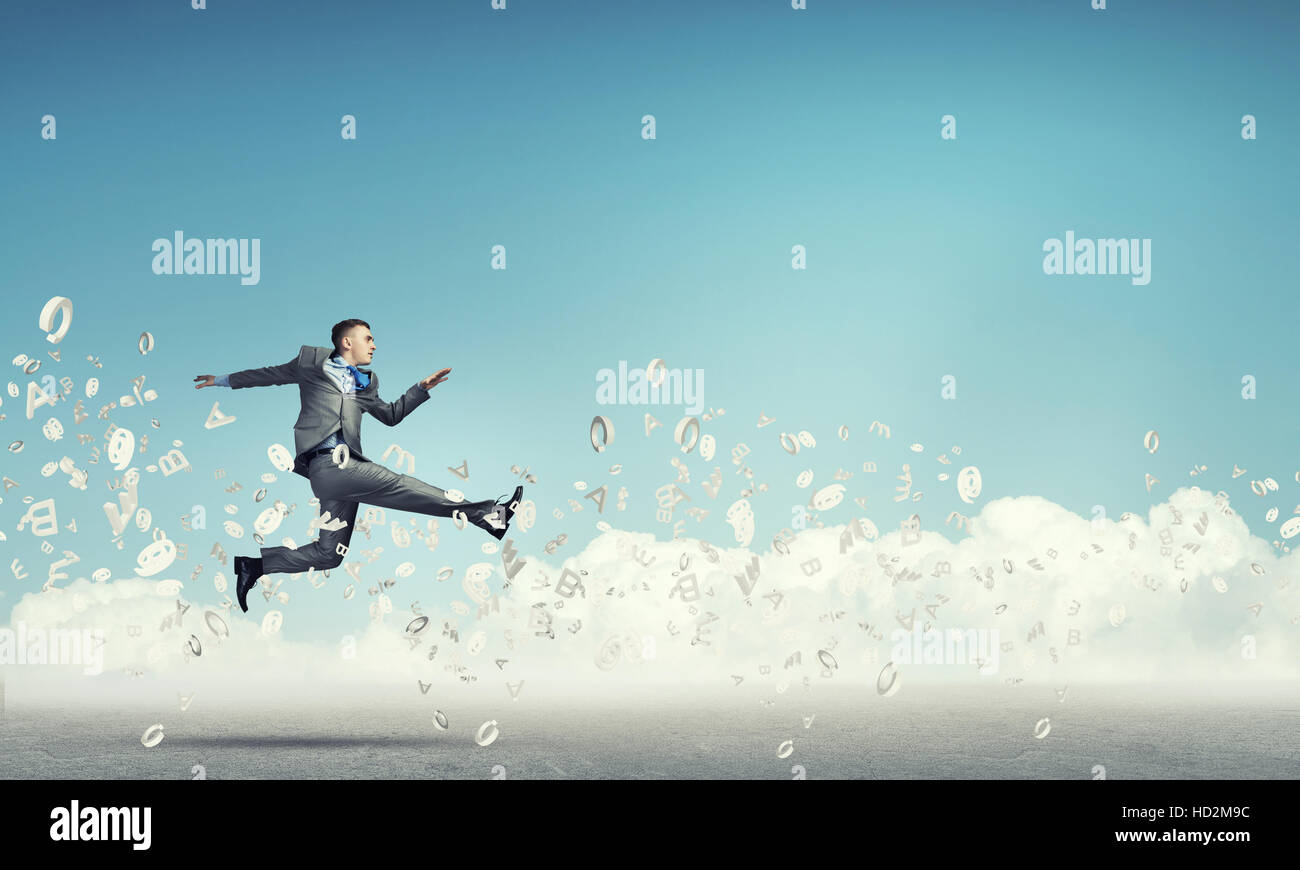 Businessman jumping high Stock Photo - Alamy