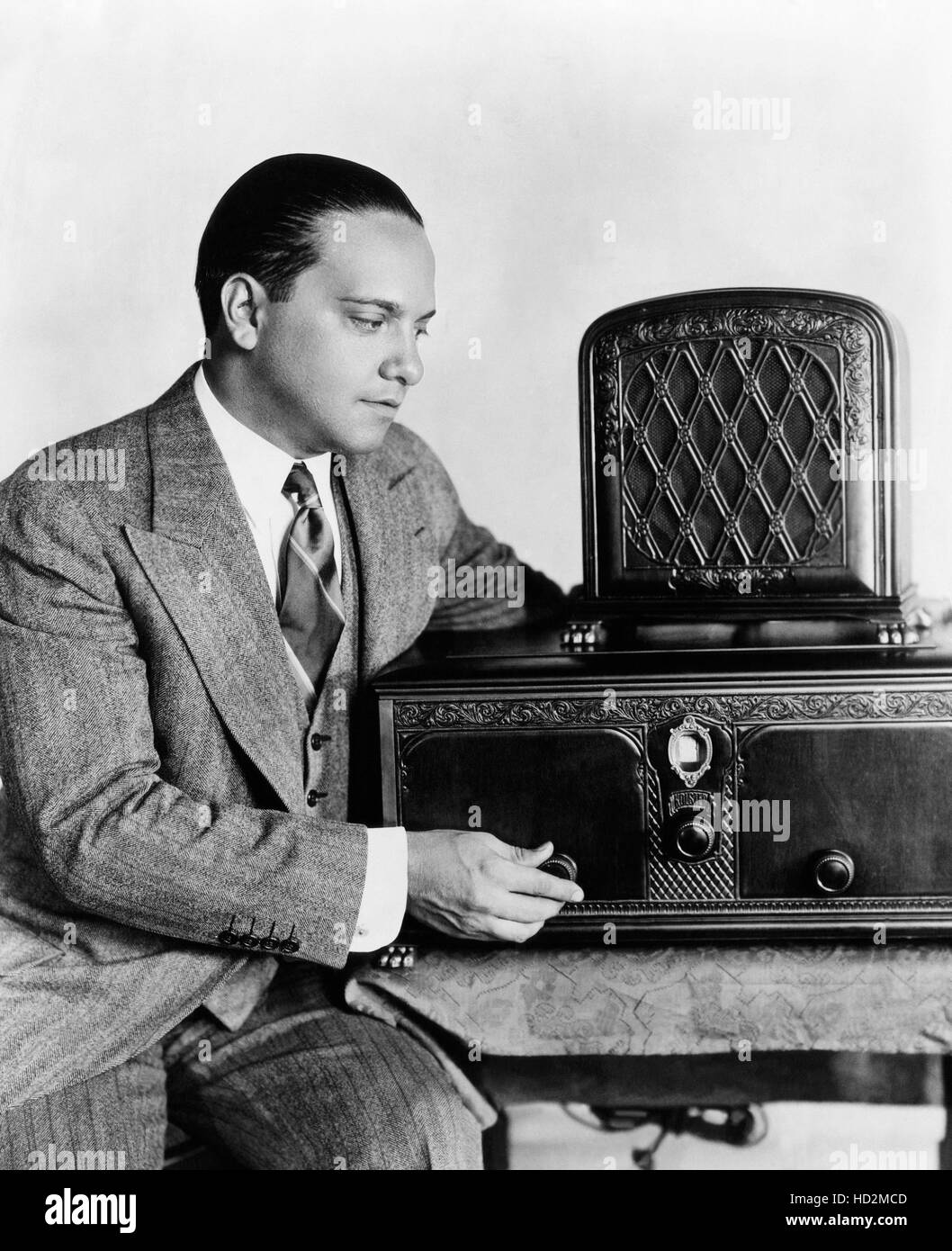 Bandleader Vincent Lopez, tuning in to the radio, 1928 Stock Photo - Alamy