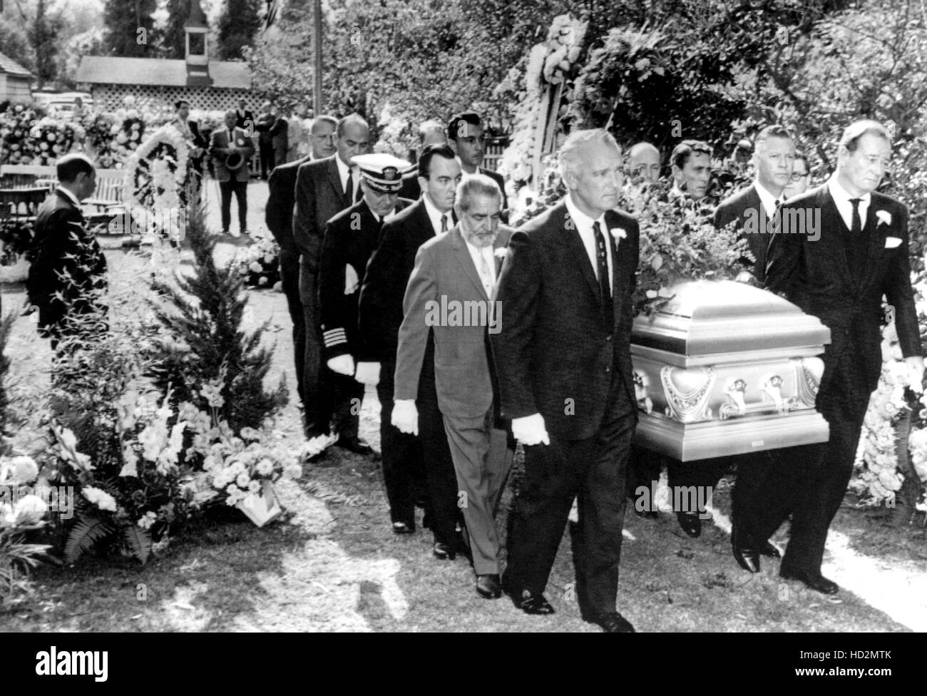 Pallbearers, including John Wayne (far right), carrying casket ...