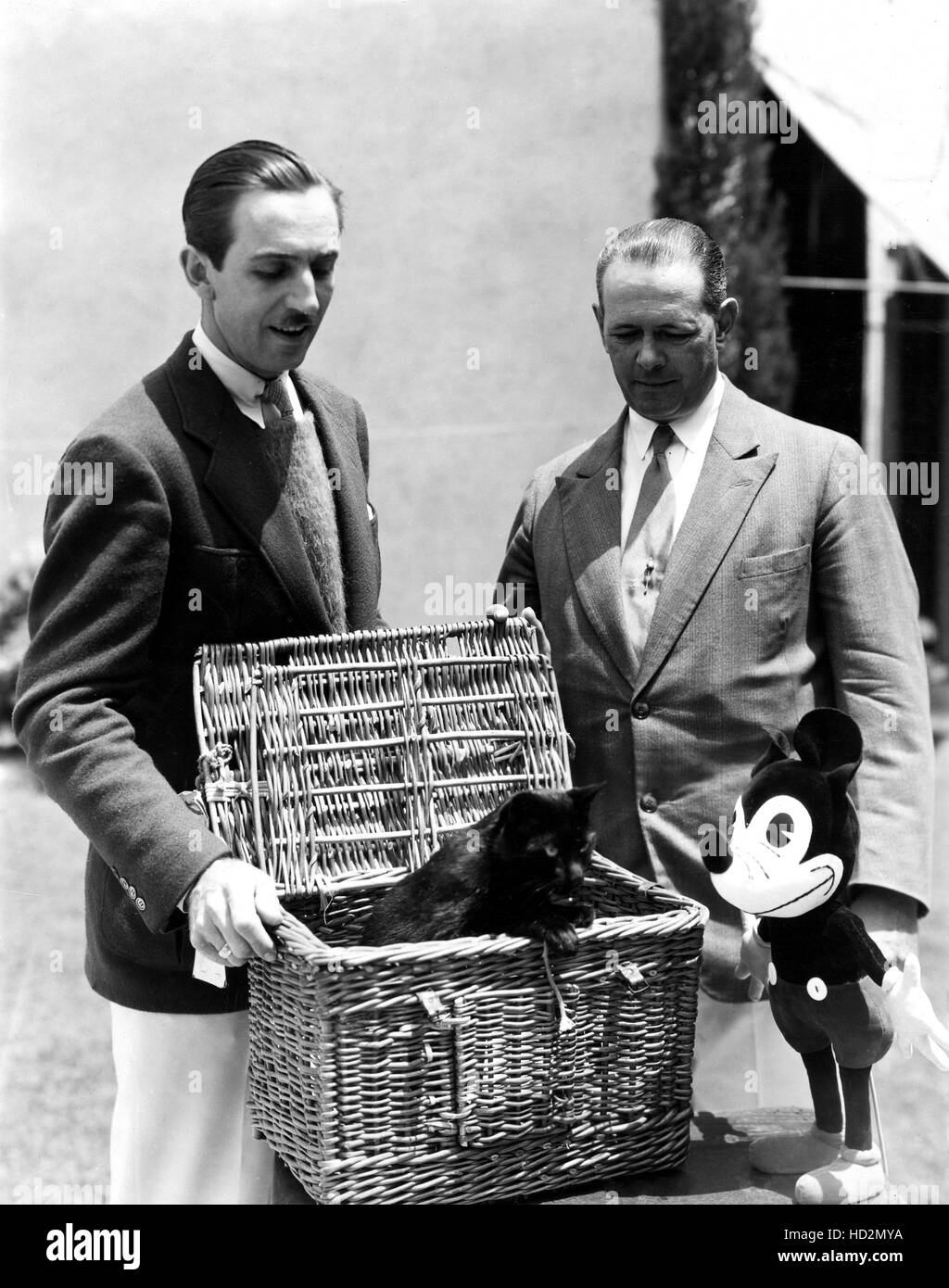 Walt Disney being presented with a manx cat by Wentworth Martyn Gurney ...