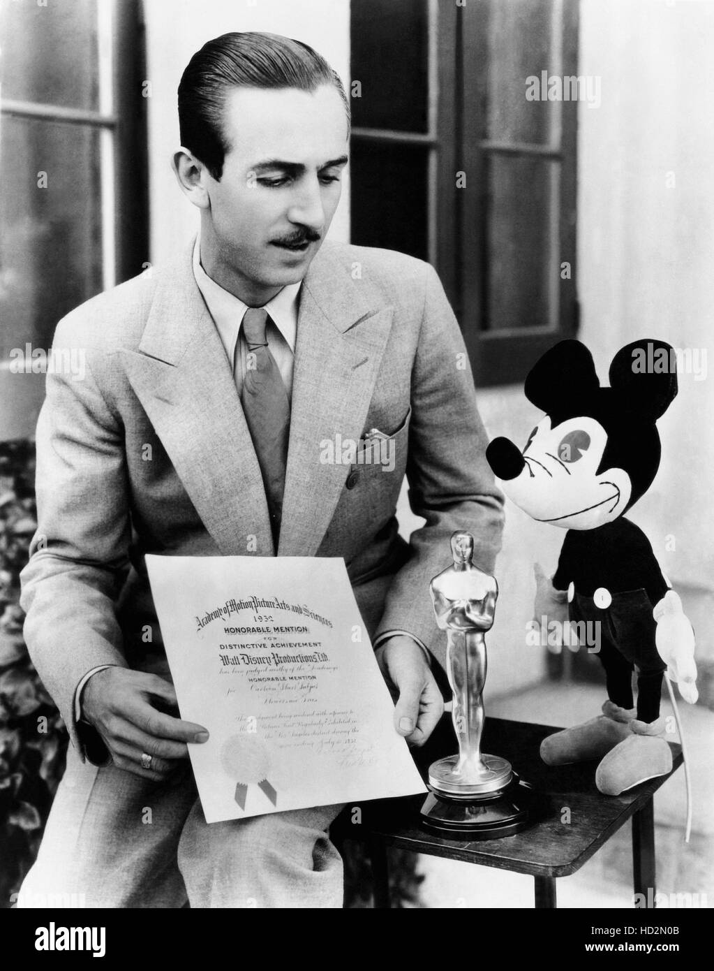 Walt Disney with Academy Award and certificate of honorable mention for ...