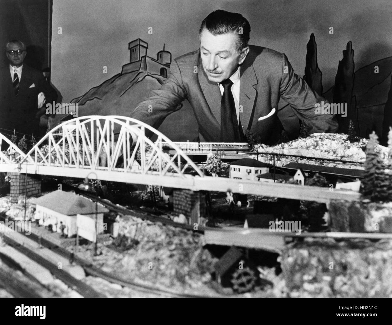 Walt Disney contemplating a model roadroad set, 1950s Stock Photo - Alamy