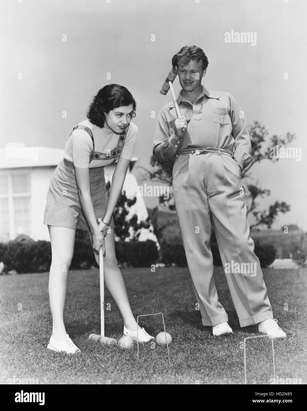 From left: Patricia O'Rourke, Wayne Morris playing croquet at home ...