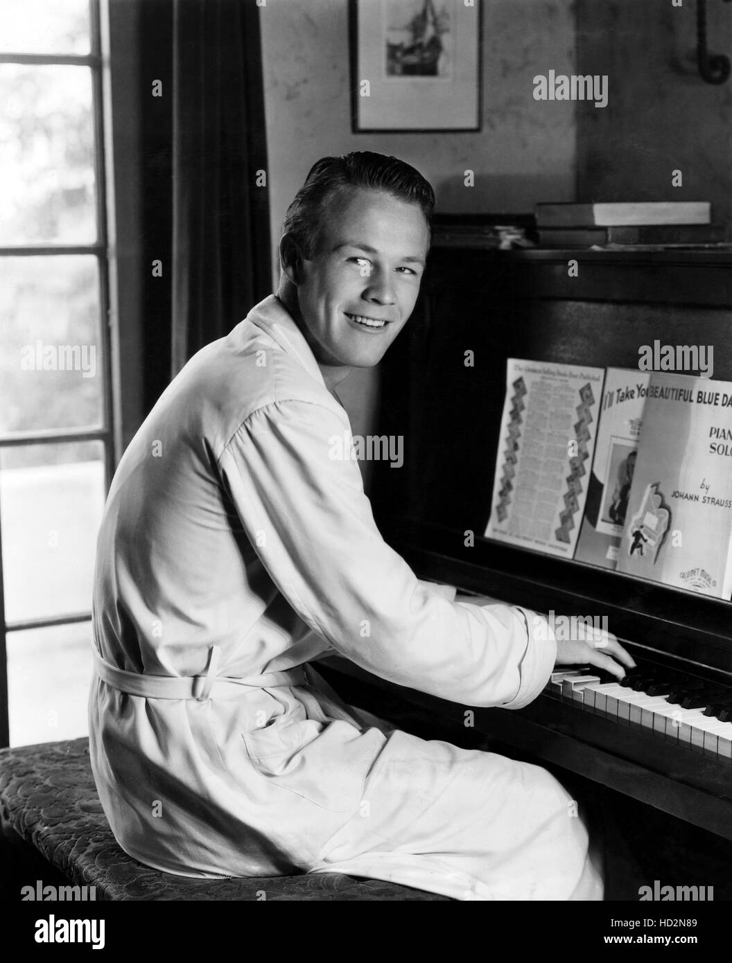 Wayne Morris playing piano at home, ca. 1937 Stock Photo - Alamy