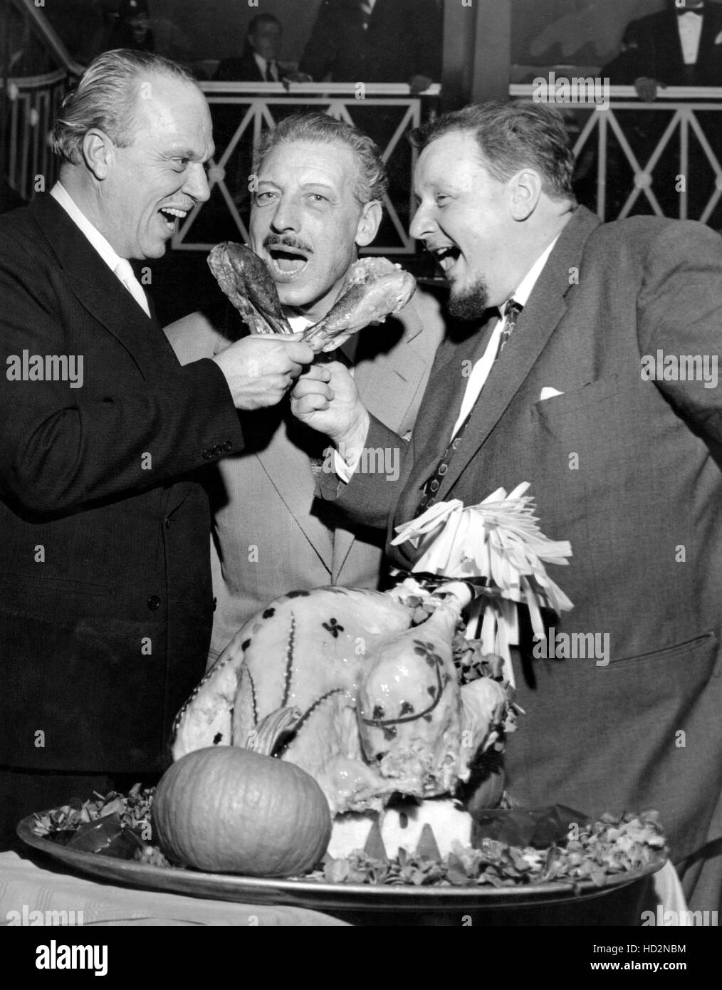 From left: Joshua Logan, Ezio Pinza, Walter Slezak eating turkey at ...