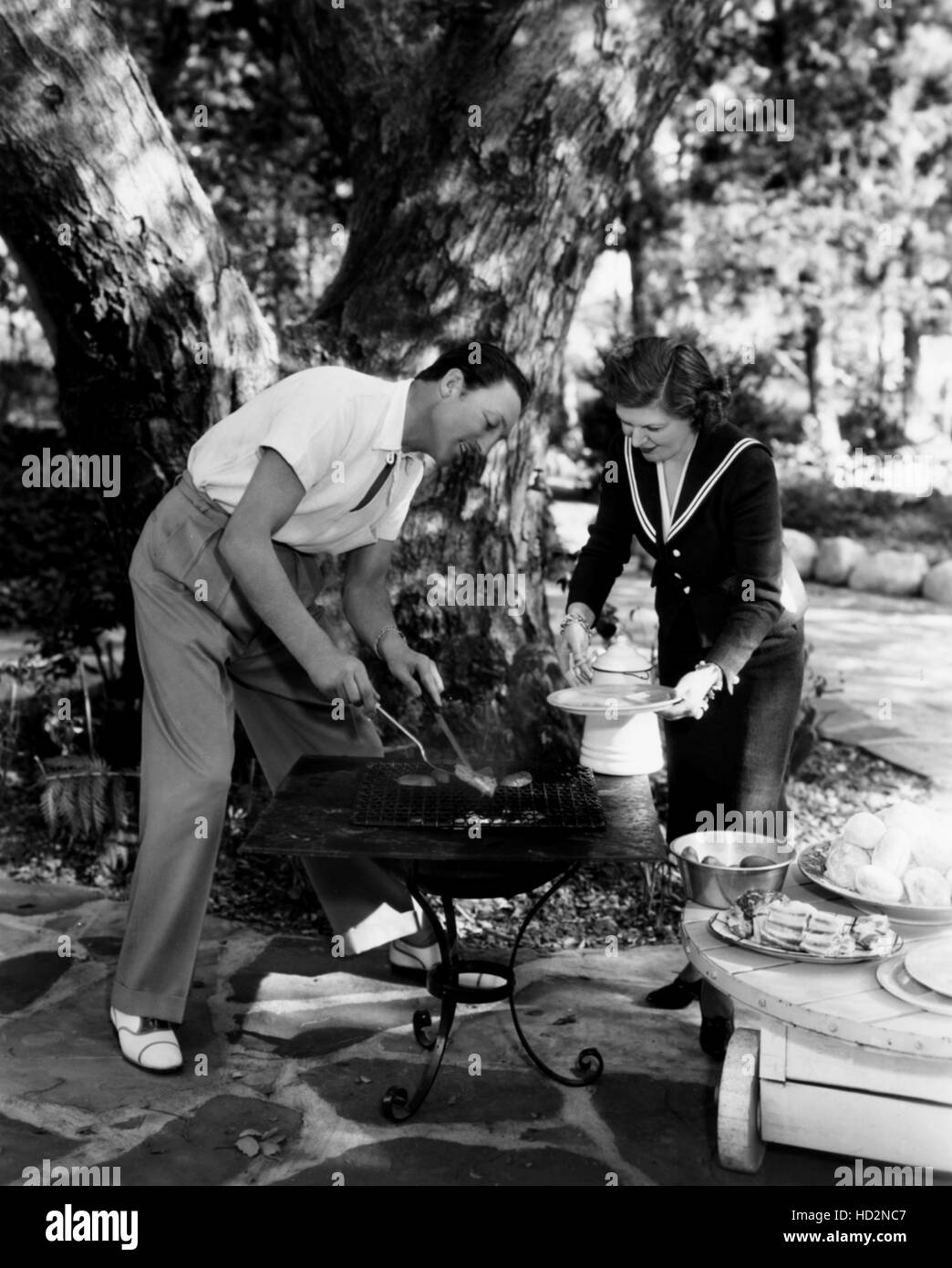 Warren William, left, and his wife, Helen William, enjoying a backyard ...