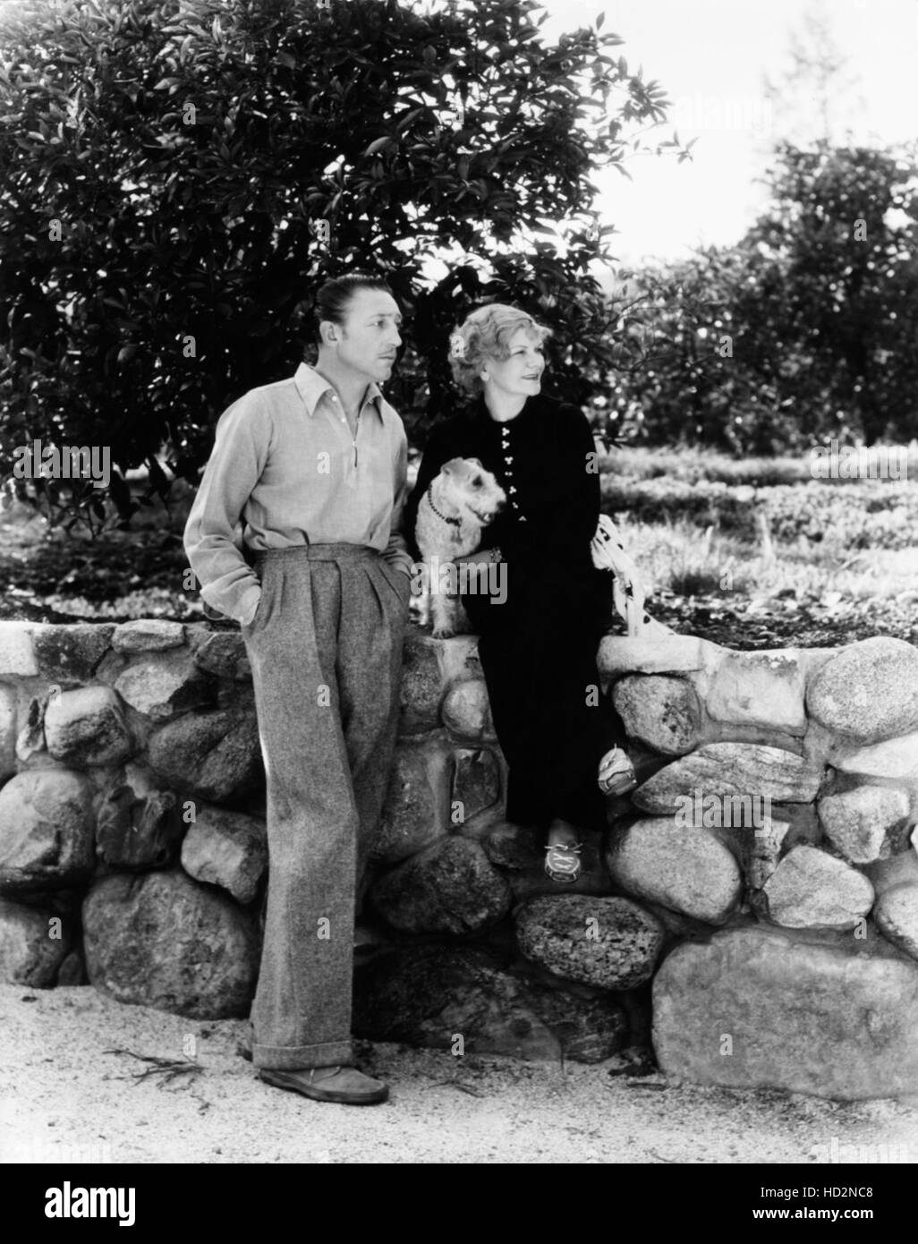 Warren William, left, and his wife, Helen William, with their terrier ...