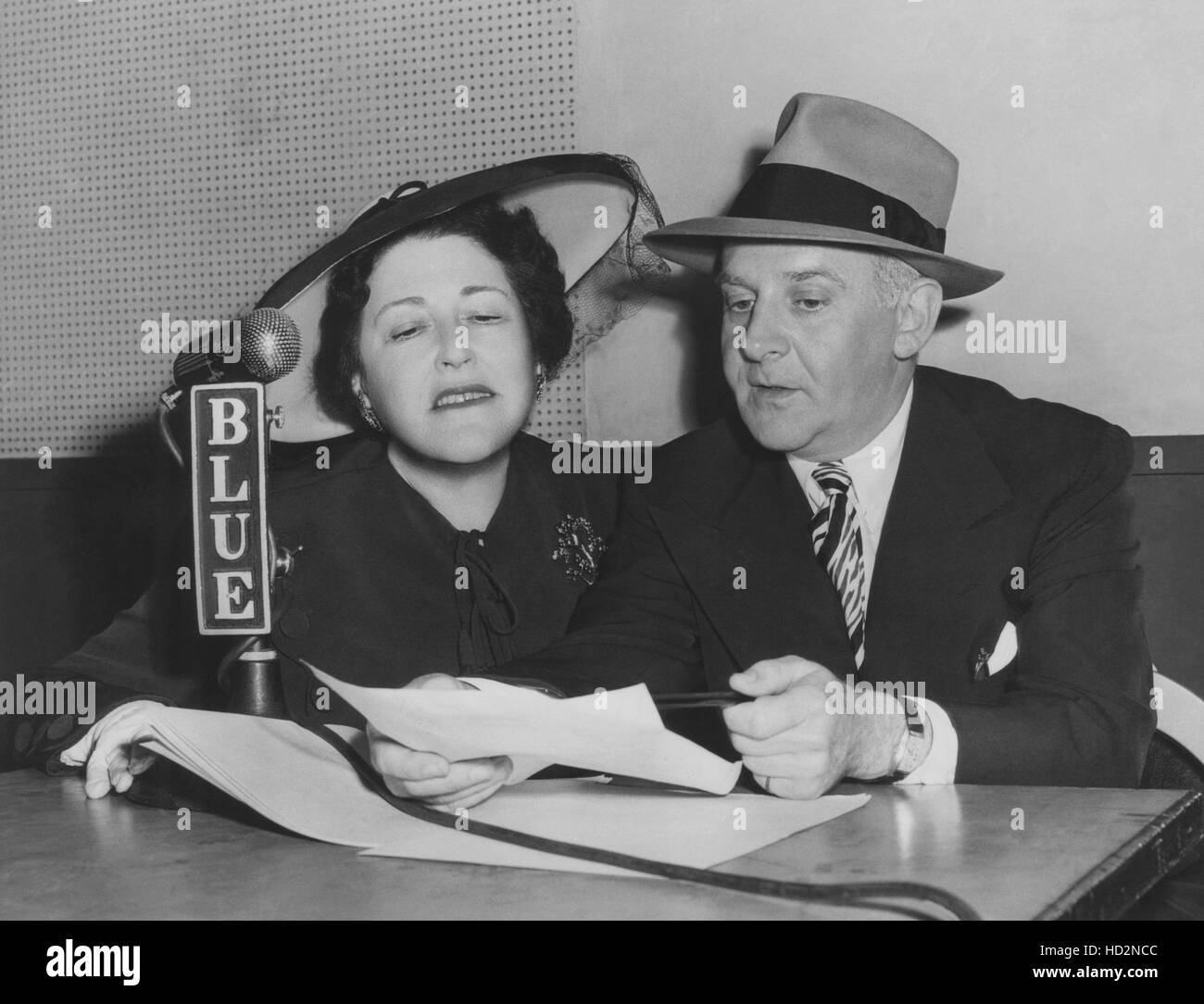 From left: Louella Parsons goes over the script with Walter Winchell ...