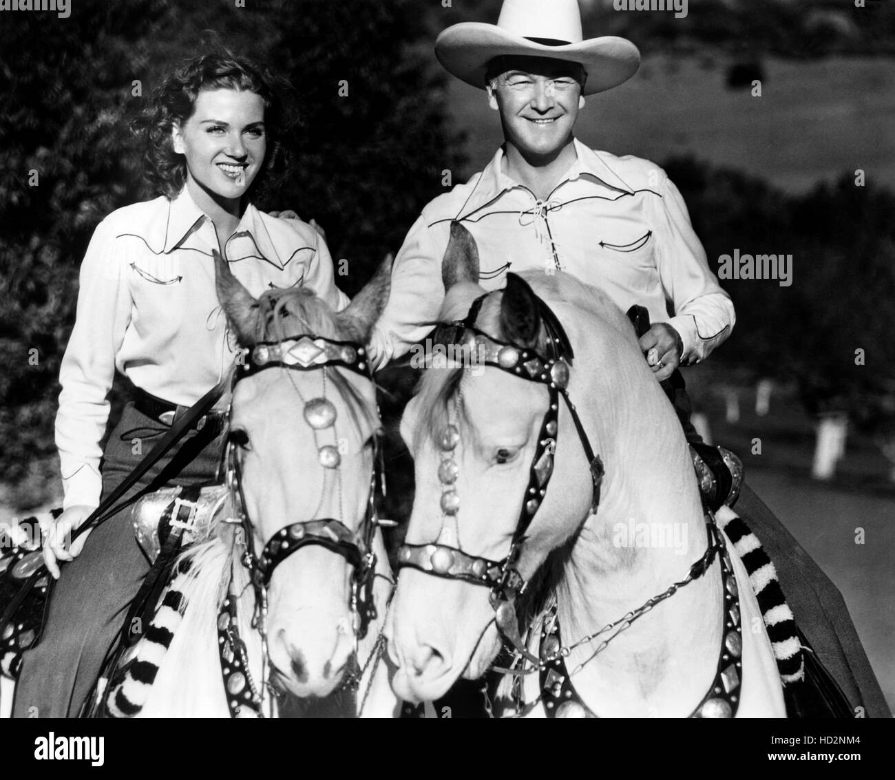 From left: Grace Bradley, William Boyd, riding horses (Topper and ...