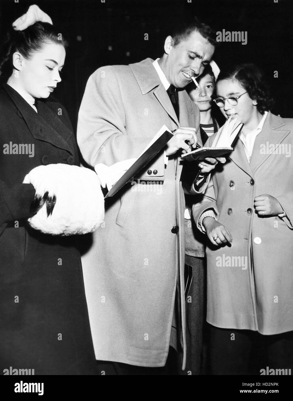From left: Buff Cobb checks the program and William Eythe signs ...