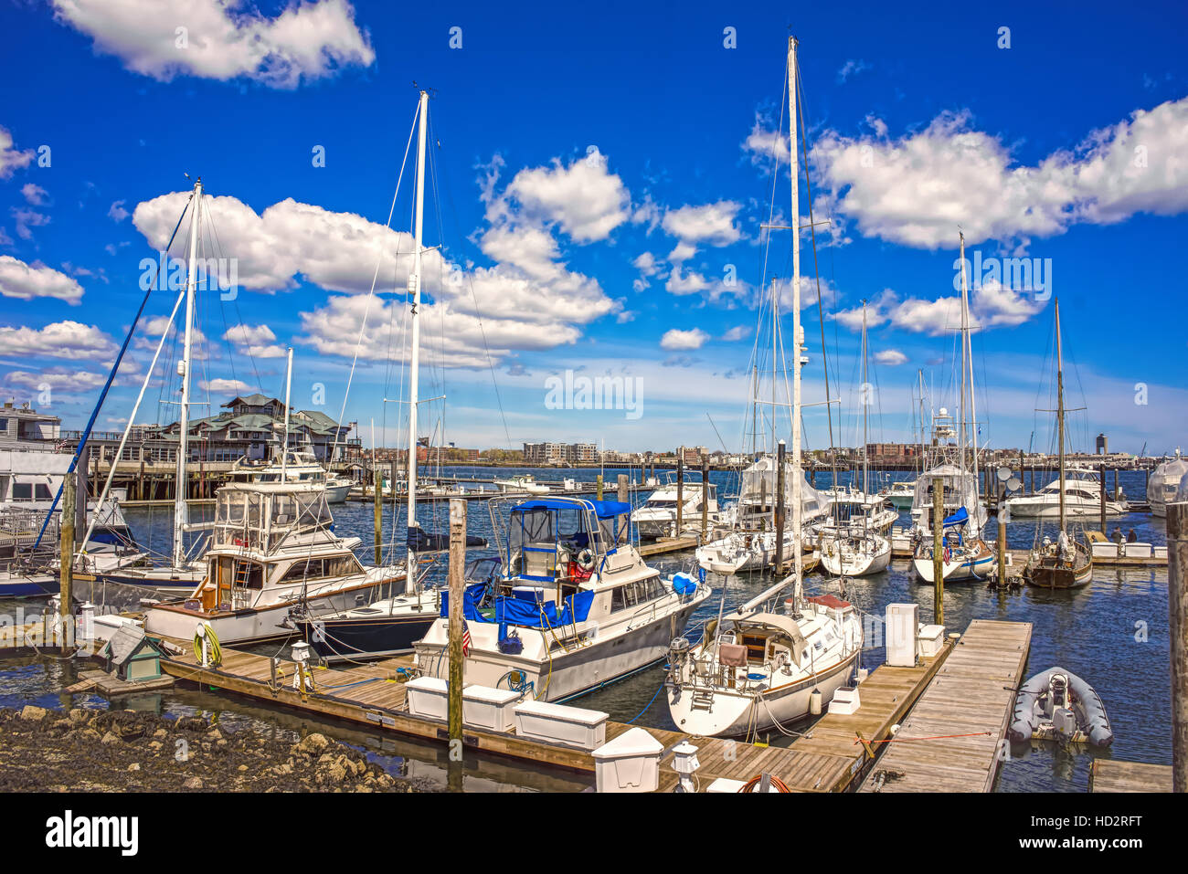 Pier of Boston Wharf with sailboats in Charles River, Boston ...