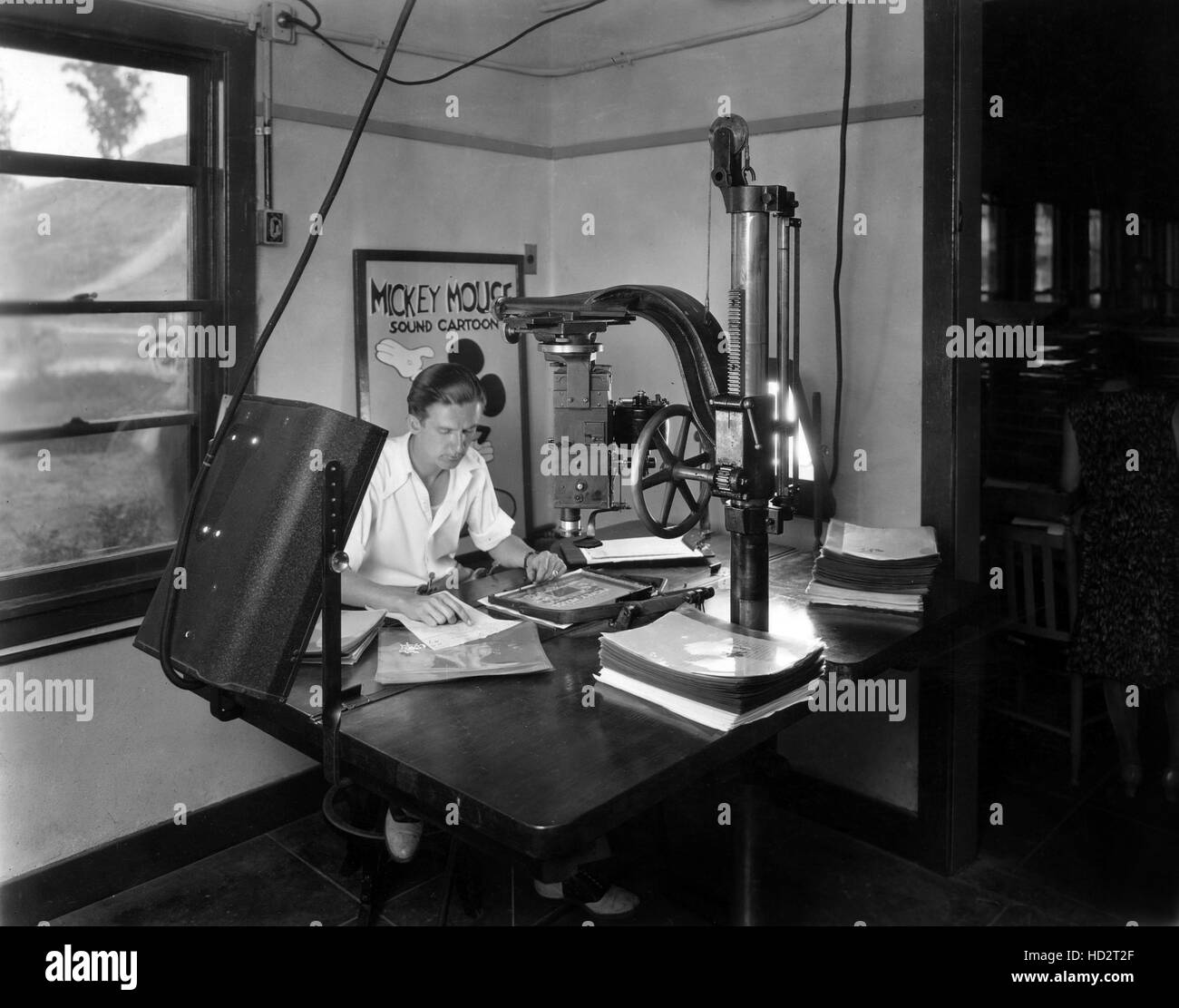 Employee at Walt Disney Studios photographs Mickey Mouse animation cell ...