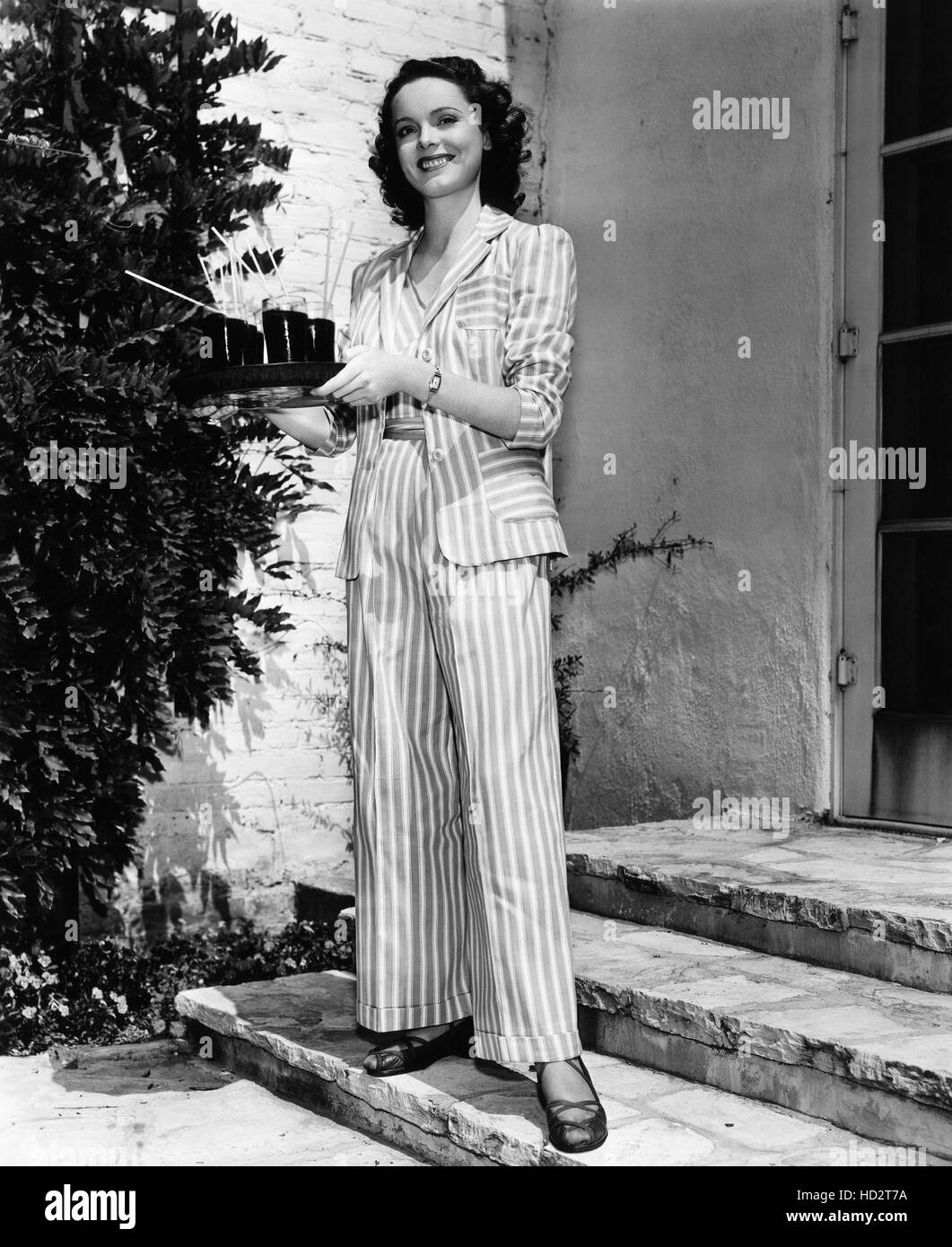 Nancy Coleman, modeling a three-piece pantsuit of striped denim, 1942 ...