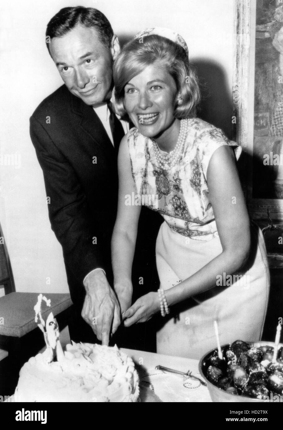 Newlyweds Alan Livingston and Nancy Olson cut their wedding cake ...