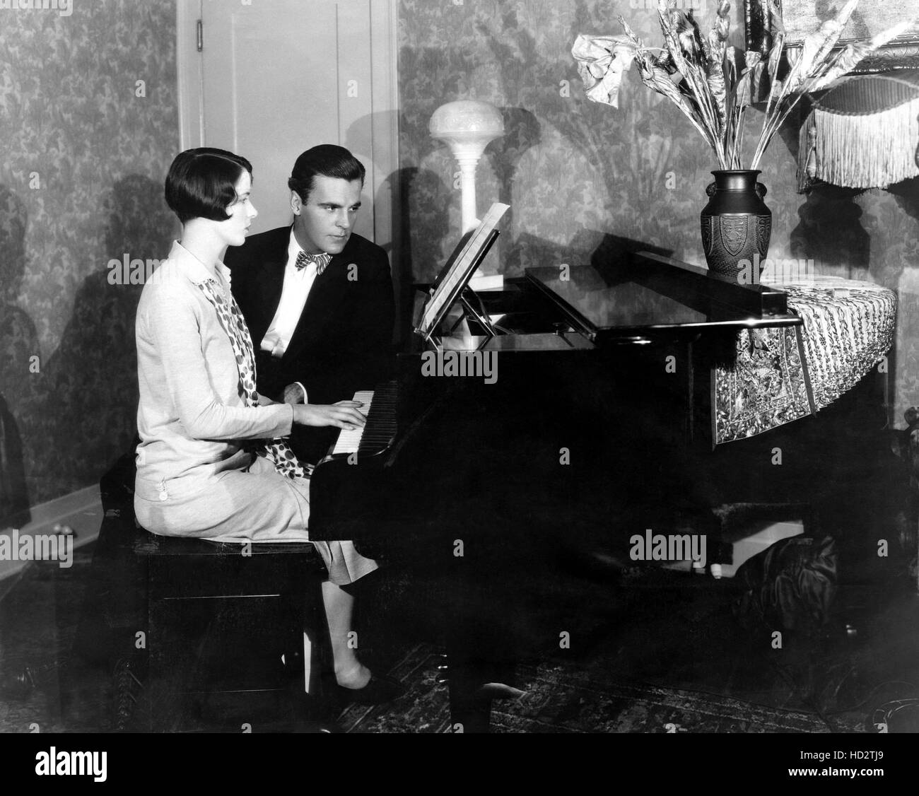 From left: Elsa Hamilton, husband Neil Hamilton playing piano at home ...