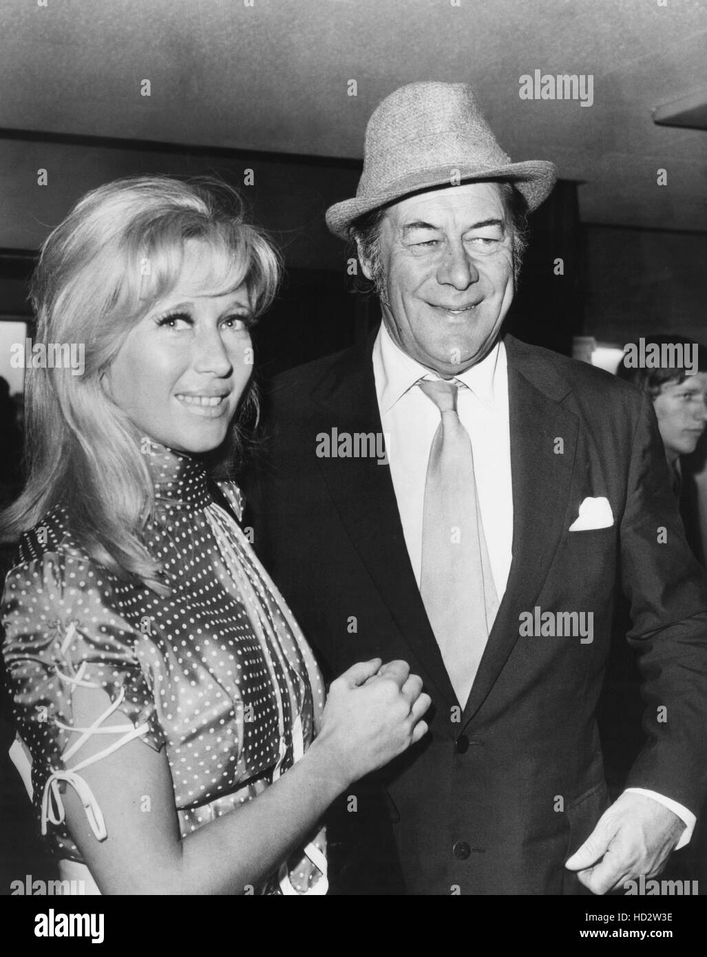 From left: Elizabeth Rees, Rex Harrison at London's Heathrow Airport ...