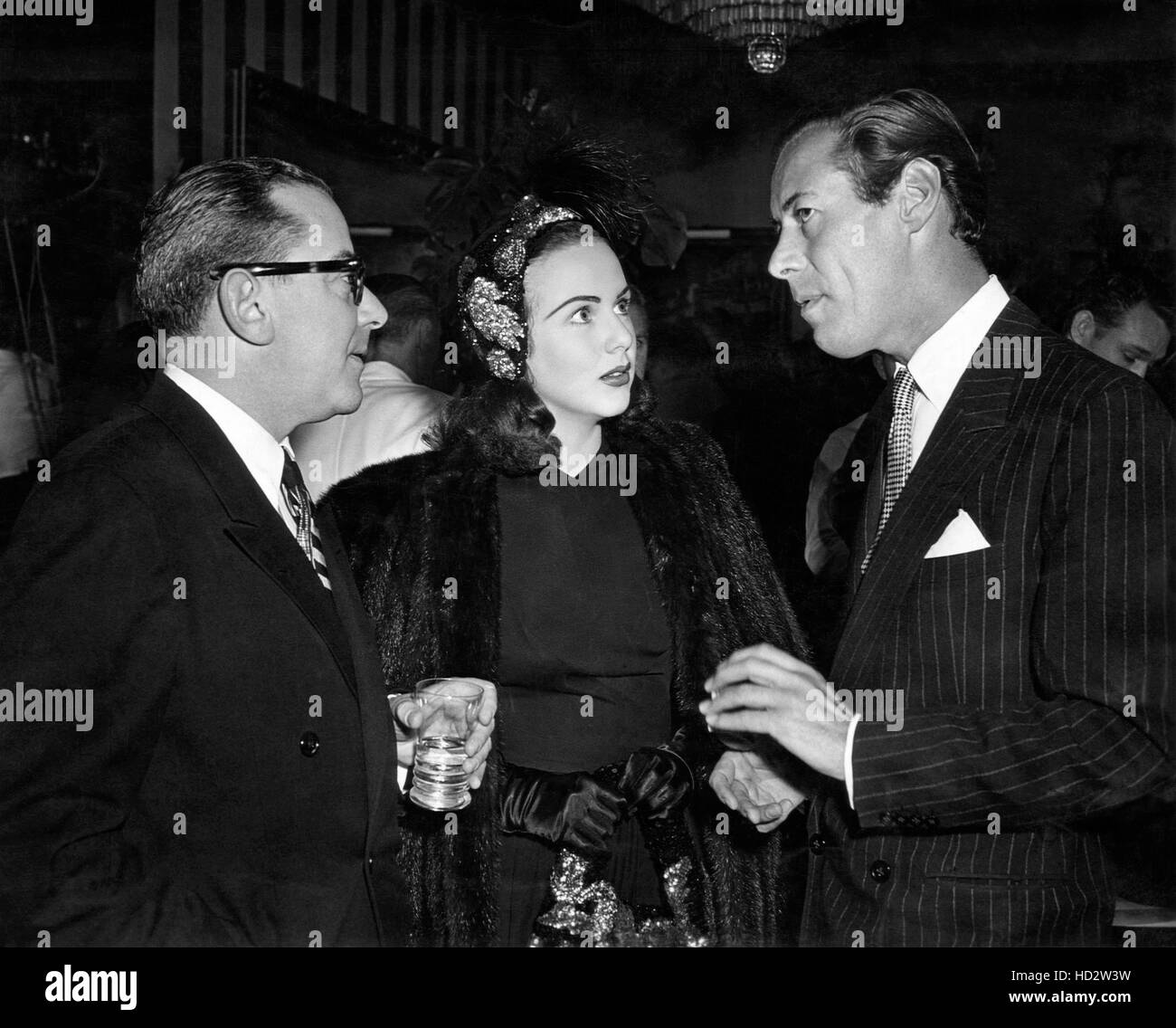 Rex Harrison (right) at cocktail party with Felix Jackson, Deanna ...