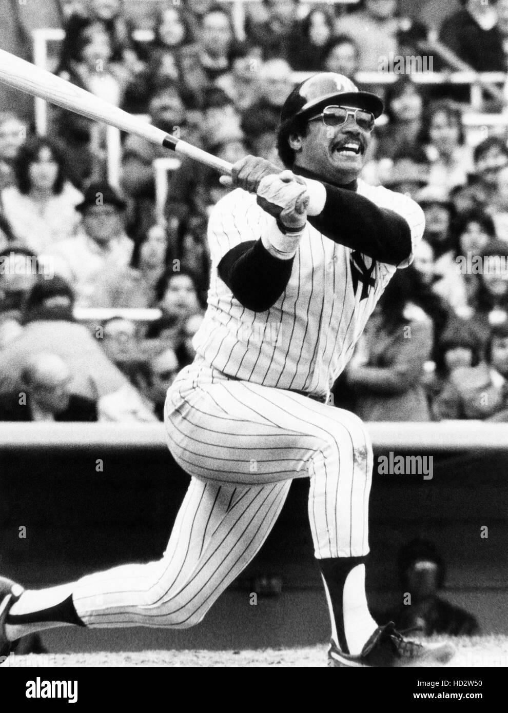 New York Yankee Reggie Jackson, hitting a single in the fourth inning ...