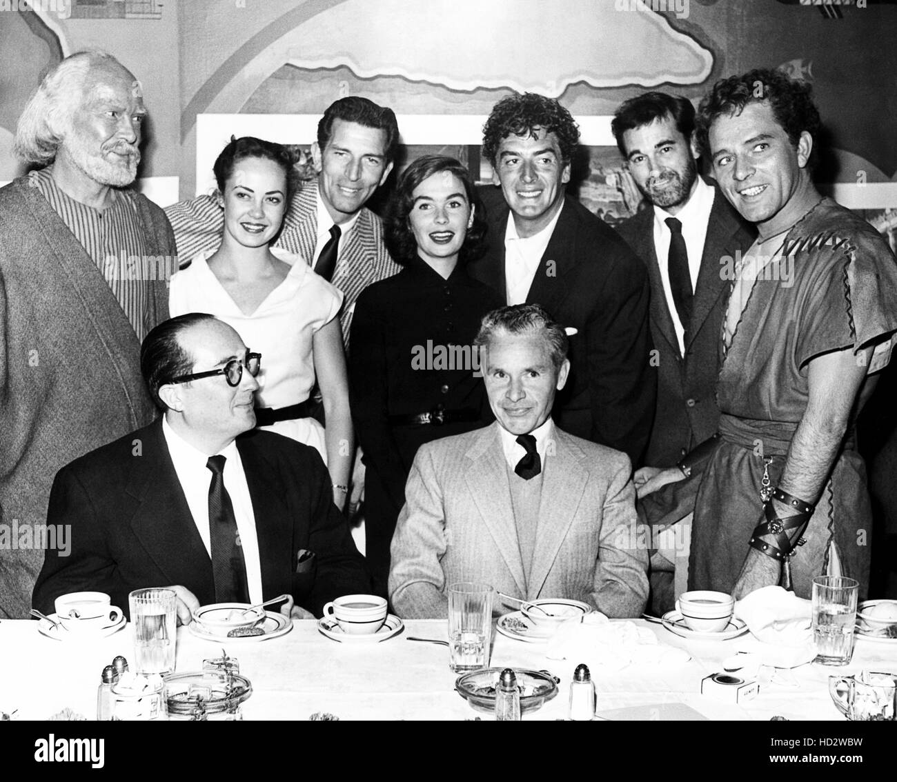 Among those pictured are director Henry Koster (seated, left), Michael ...