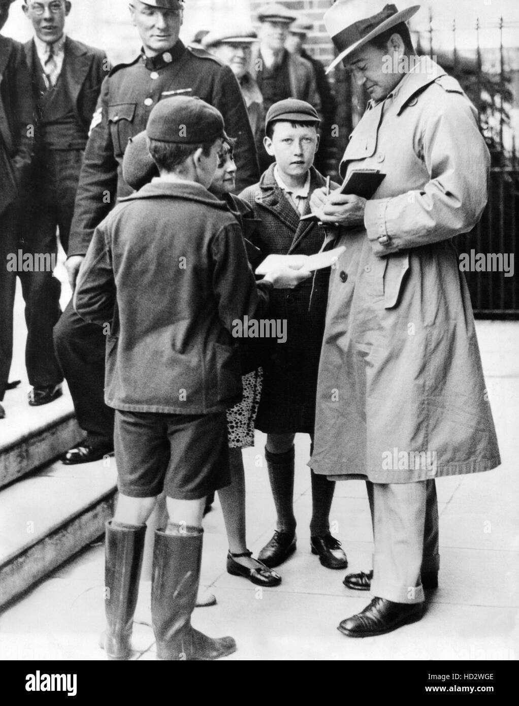 Richard Dix signing autograph for young fans, London, England, 1935 ...