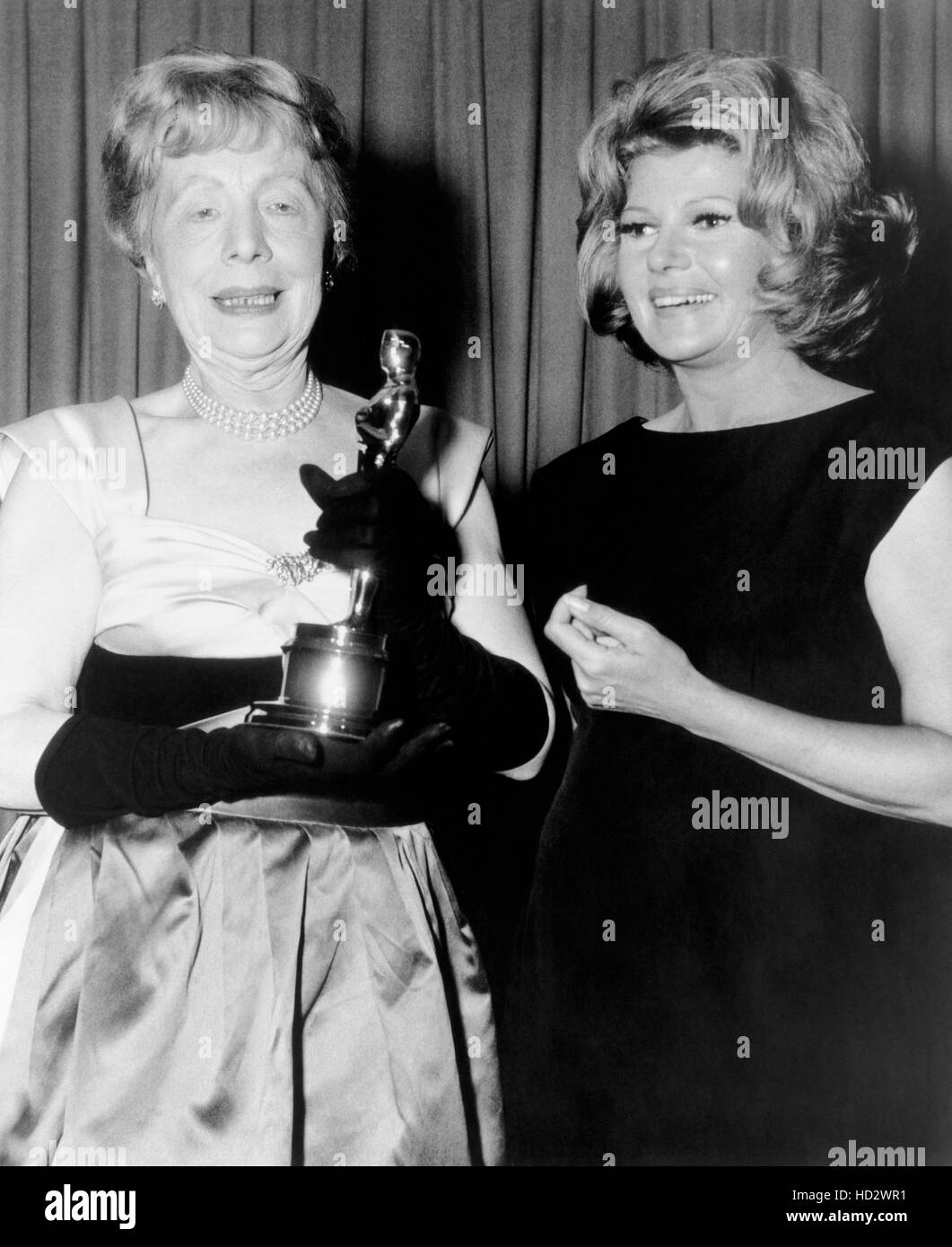 Edith Evans, left, and Rita Hayworth, at the Academy Awards ceremony ...