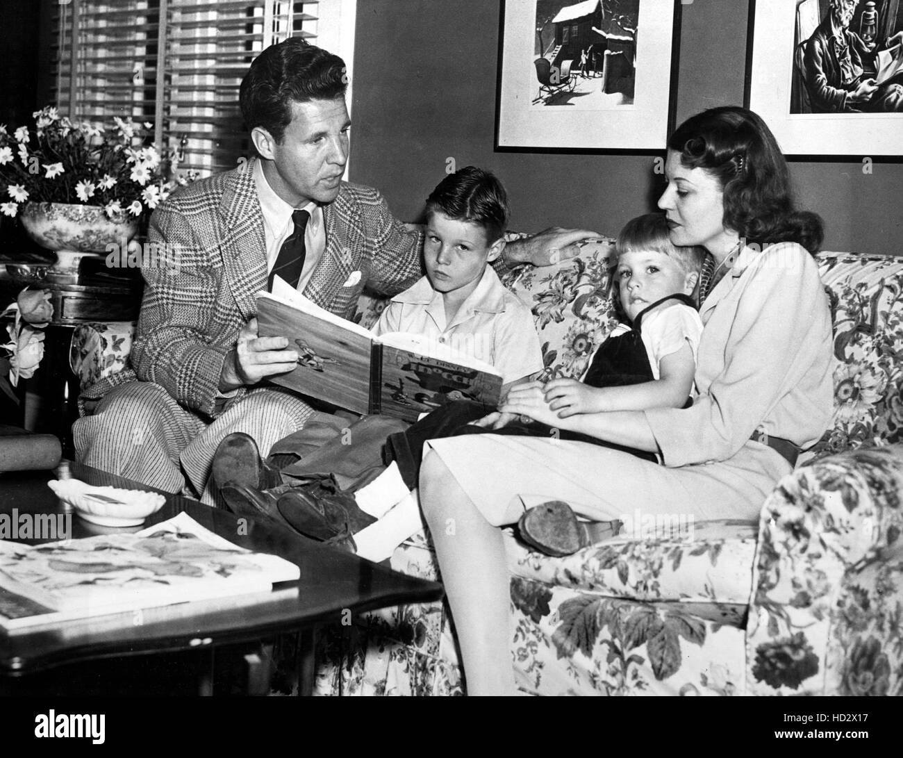 OZZIE NELSON, DAVID NELSON, RICKY NELSON and HARRIET NELSON at home, c ...
