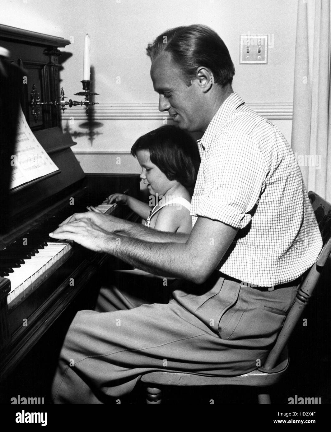 ANN WIDMARK and father RICHARD WIDMARK practice playing the piano ...