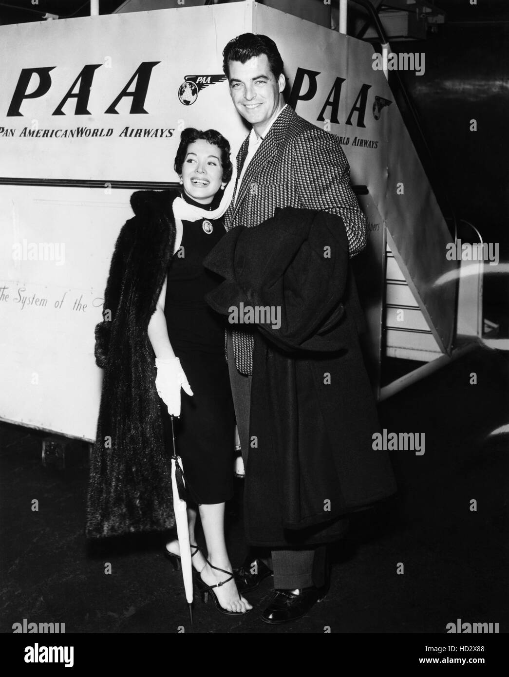 Rory Calhoun (right) and wife Lita Baron en route to Hong Kong to film ...