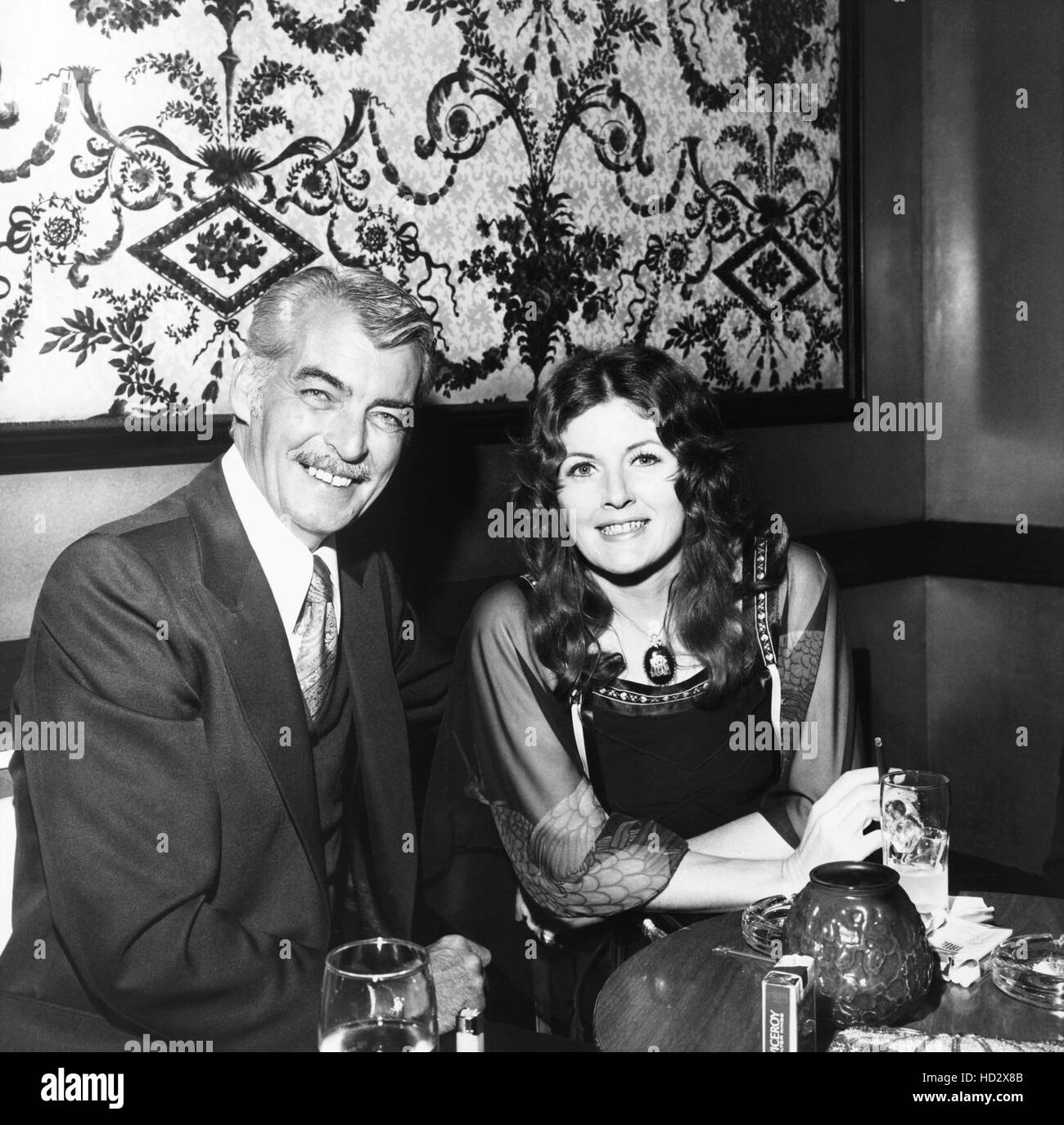 From left: Rory Calhoun with wife Susan Kathleen Langley, 1970s Stock ...