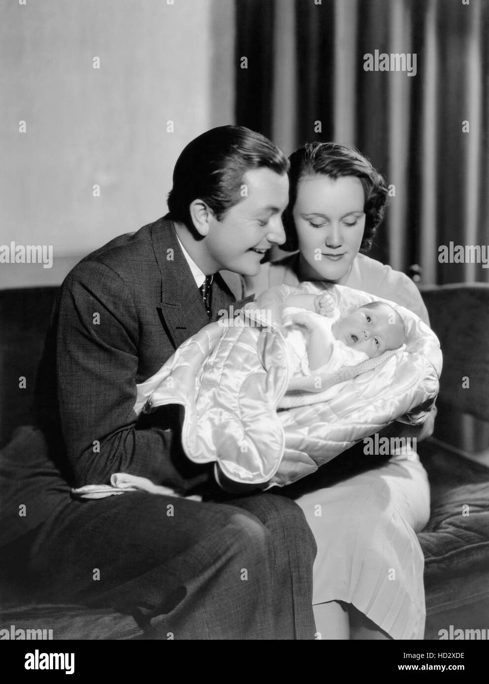 Robert Young and Elizabeth Henderson Young holding their newborn ...