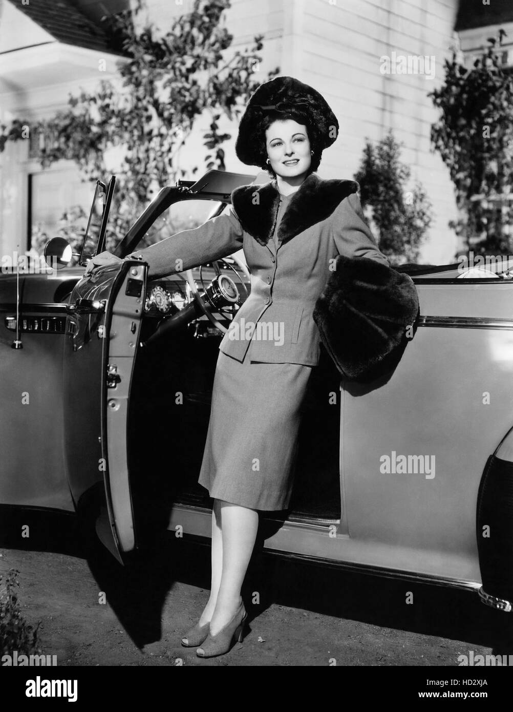 Ruth Hussey, modeling a gray wool suit with nutria trim and muff, 1942 ...