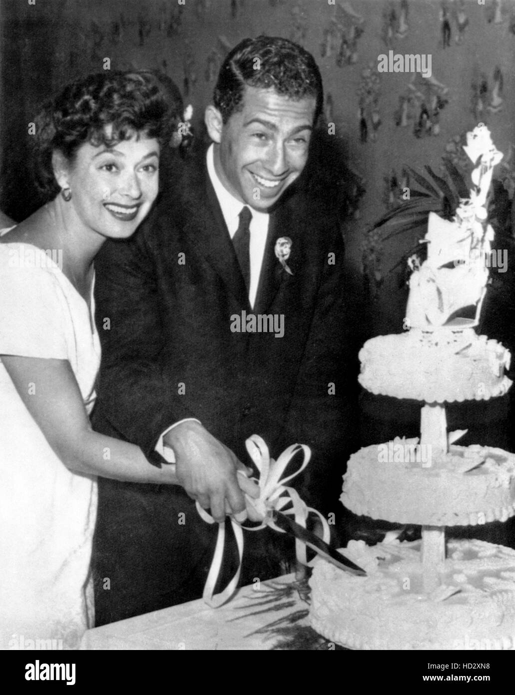 From left: Newlyweds Ruth Roman and Budd Moss cutting wedding cake ...
