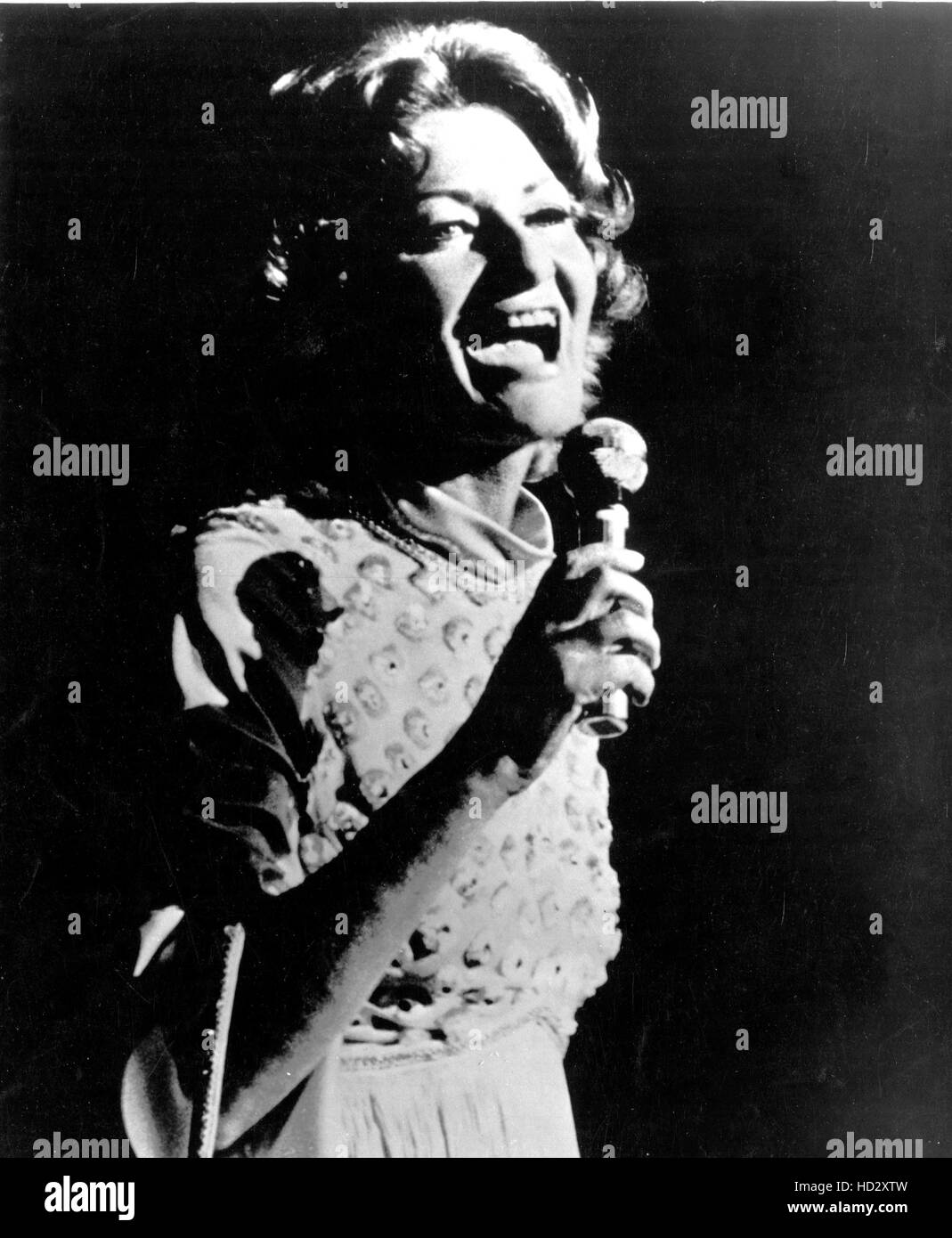 Rusty Warren, in performance, ca. early 1970s Stock Photo - Alamy