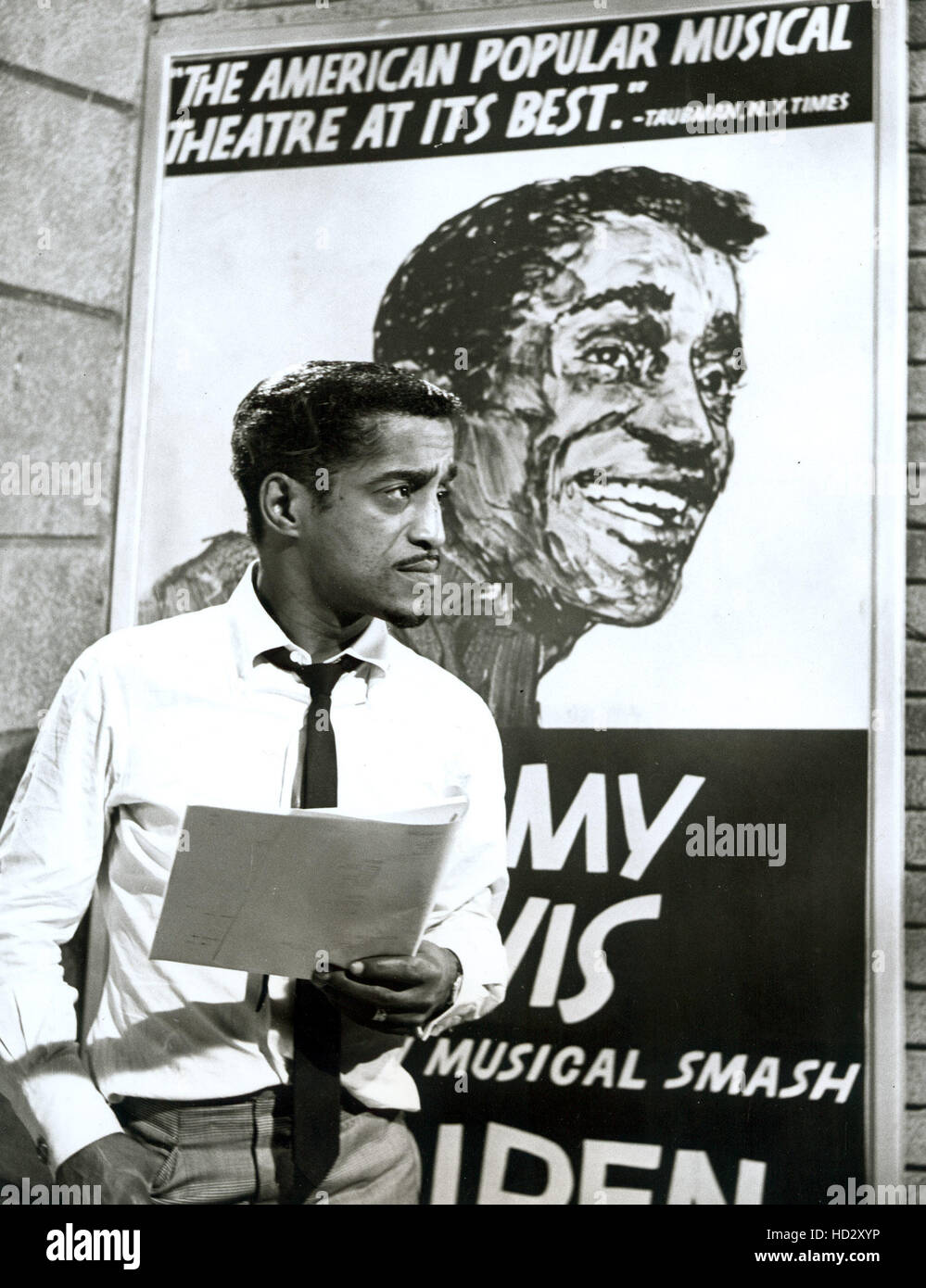 Sammy Davis, Jr. in front of a poster for his 1964 Broadway hit 'Golden ...