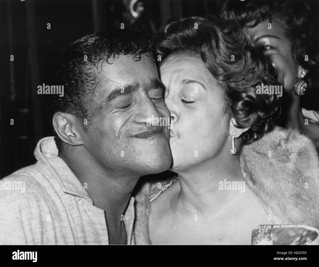 Sammy Davis Jr being kissed by his mother Elvera after the opening of ...