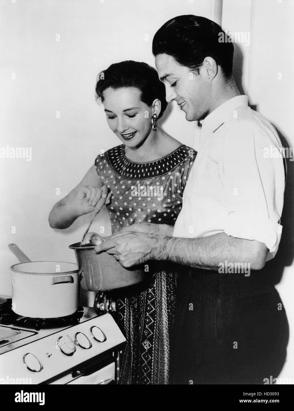 Taina Elg, left, and her husband, Carl Bjorkenheim, cooking dinner ...