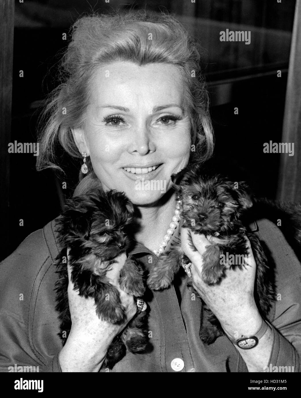 Zsa Zsa Gabor cuddling with her two terriers, Zsa Zsa and Eva Super ...