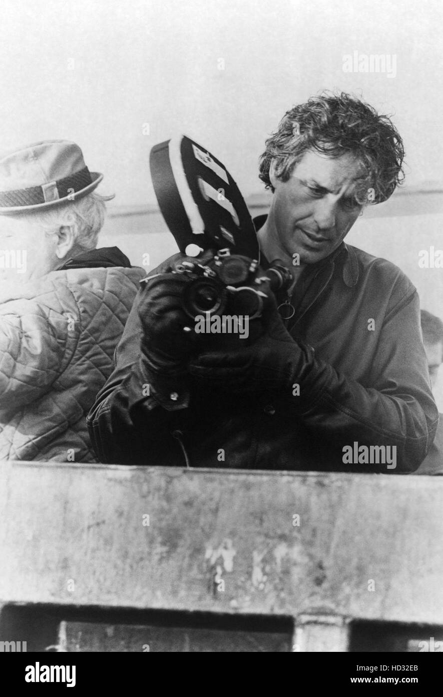 Actor/director John Cassavetes (holding camera), ca 1980 Stock Photo ...