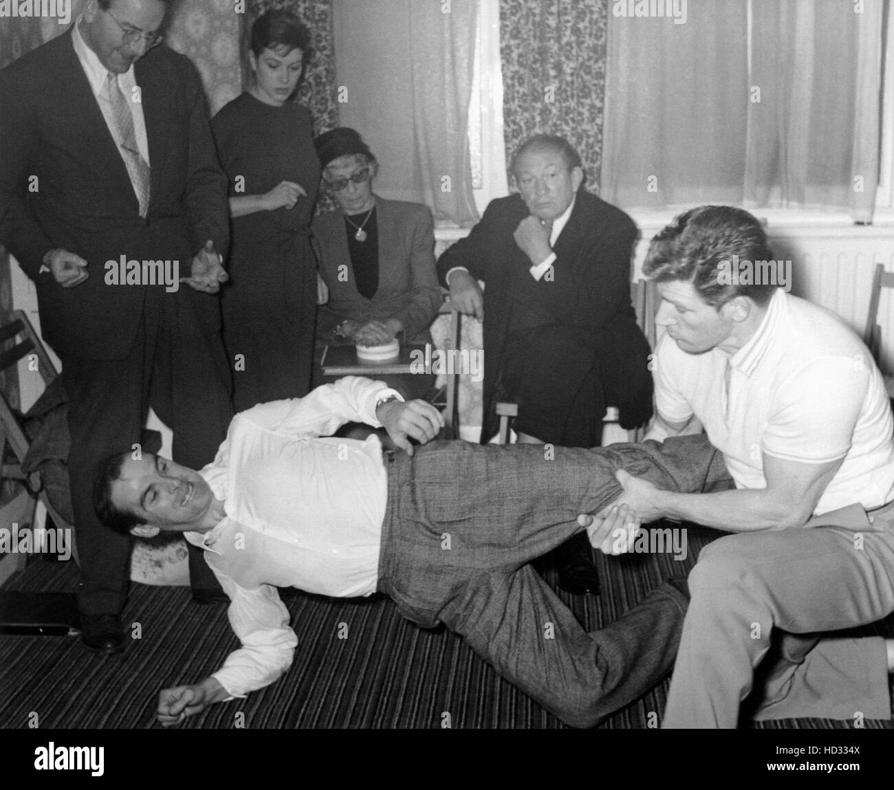 From front: actor Stanley Baker and stuntman Joe Robinson rehearse a ...