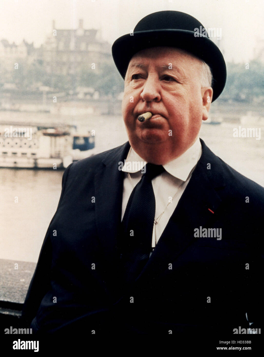 FRENZY, director Alfred Hitchcock, wearing a bowler hat and smoking ...