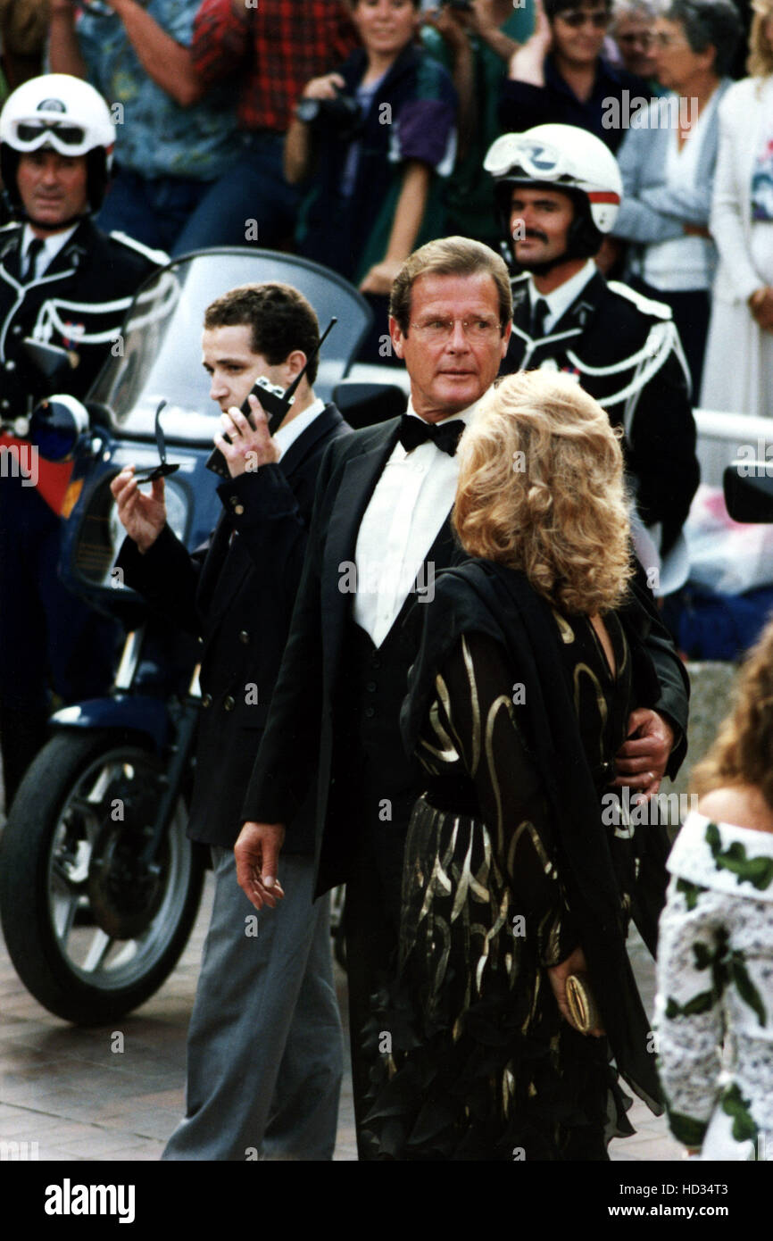 Roger Moore with wife at Cannes Film Festival 1989, by Thierry Carpico ...
