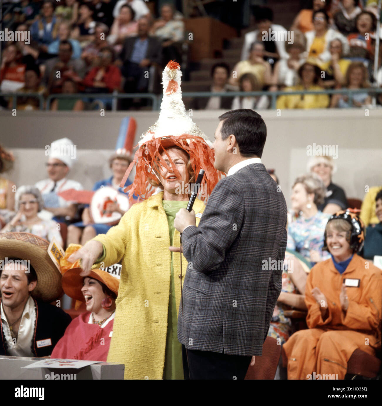 LET'S MAKE A DEAL, host Monty Hall (standing, right) with a contestant ...